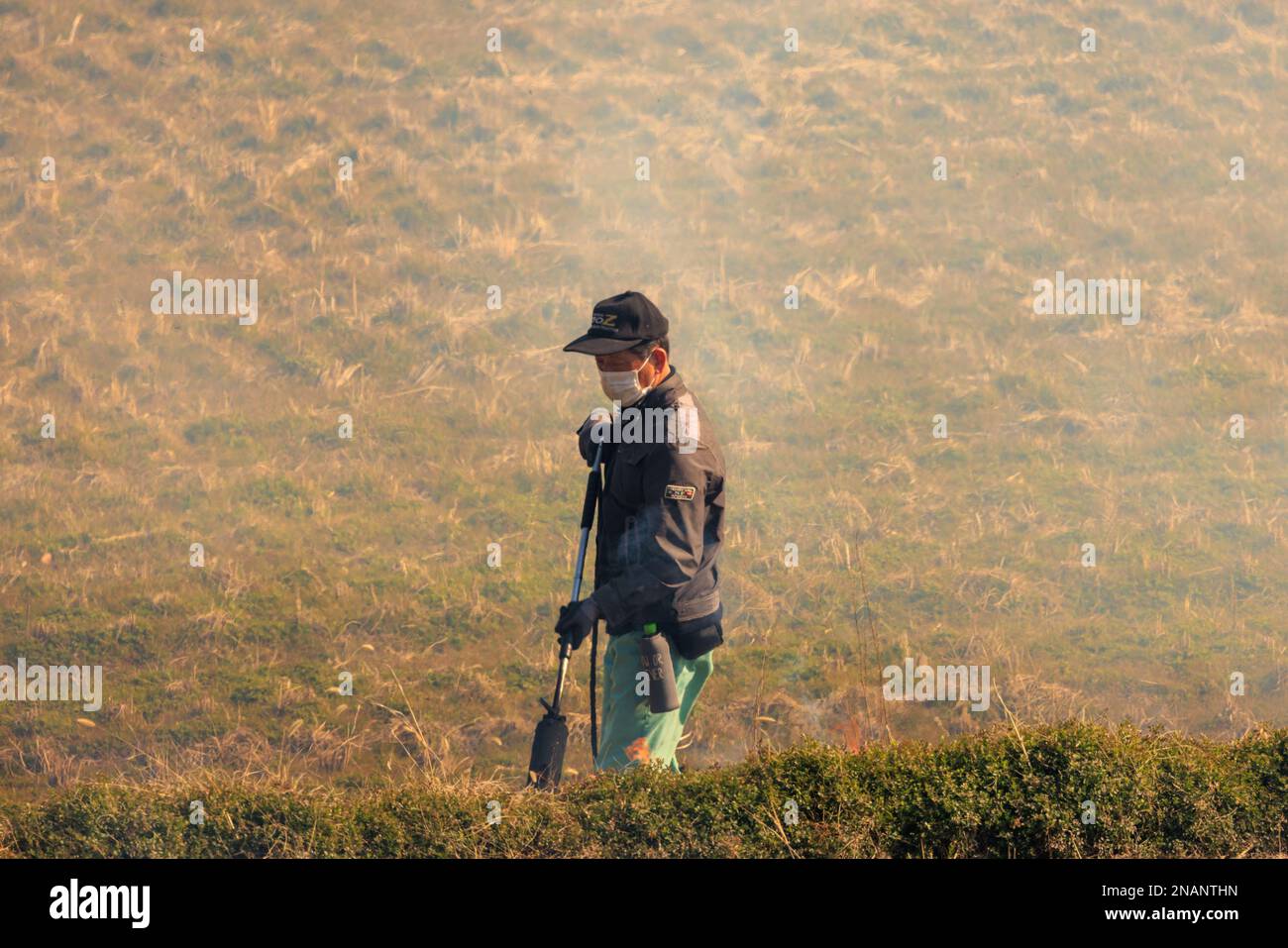Hyogo, Japan - February 5, 2023: Fire fighter with flame thrower walks ...