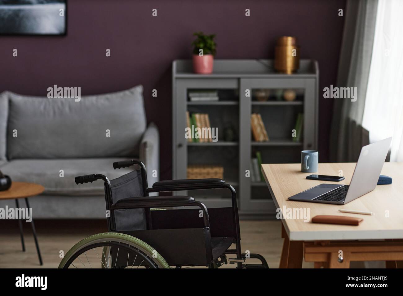 Horizontal image of wheelchair for person with disability standing in ...