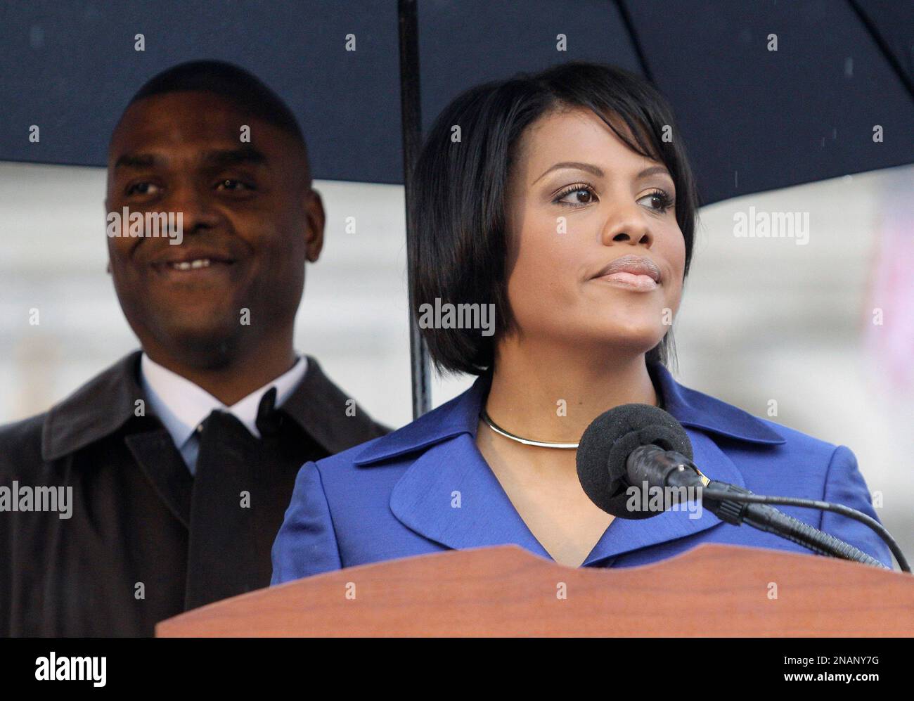Baltimore Mayor Stephanie Rawlings-Blake speaks in front of her husband ...