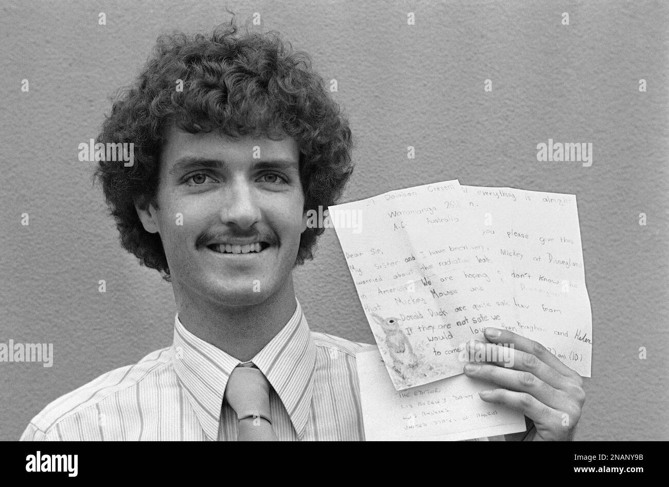 Gordon Ownby holds up a letter written by two Australian children to a ...