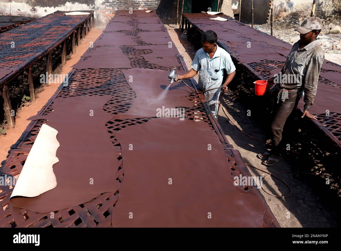 February 13, 2023, Dhaka, Dhaka, Bangladesh: Workers dye leather and ...