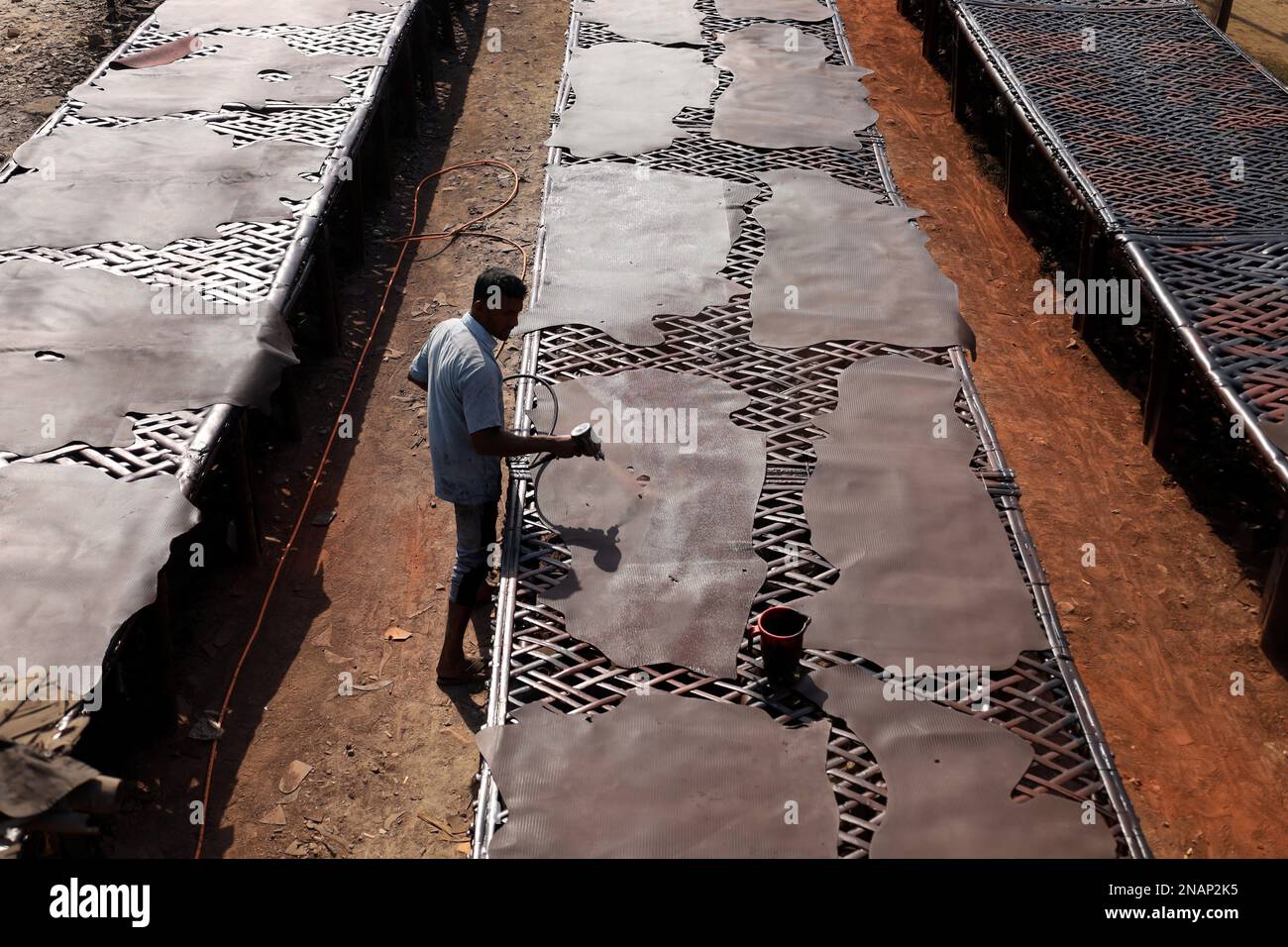 Dhaka, Dhaka, Bangladesh. 13th Feb, 2023. Workers dye leather and dry ...