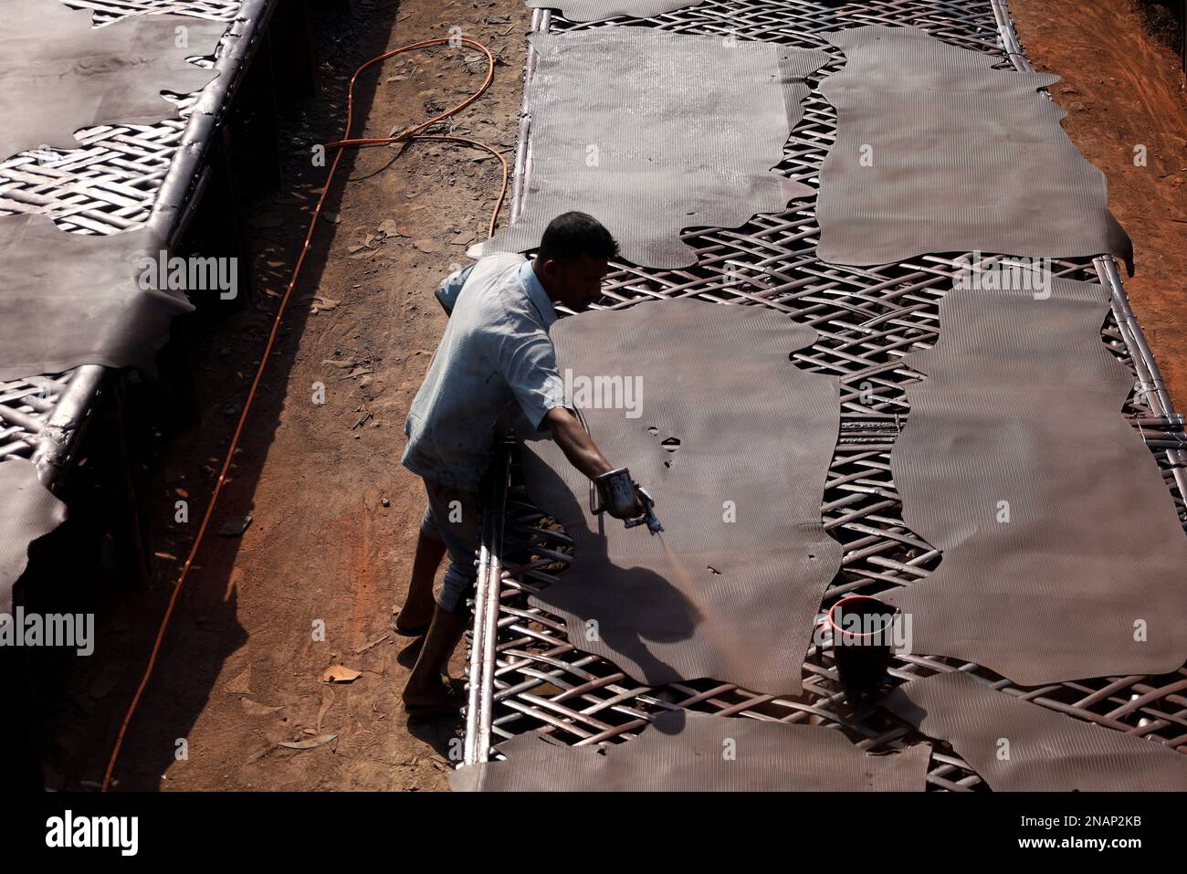 Dhaka, Dhaka, Bangladesh. 13th Feb, 2023. Workers dye leather and dry ...