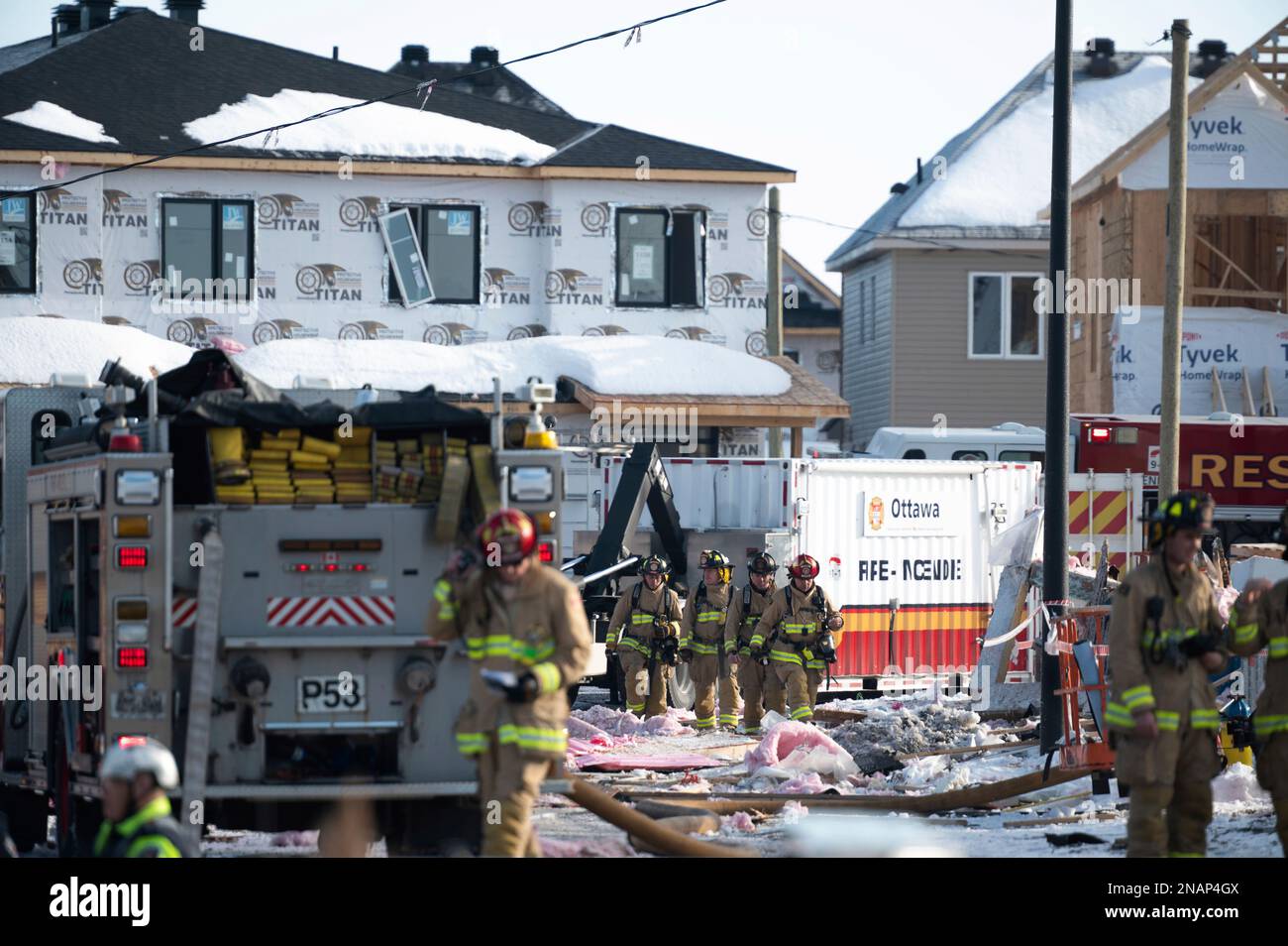 Firefighters from the Ottawa Fire Service work the scene of an early ...