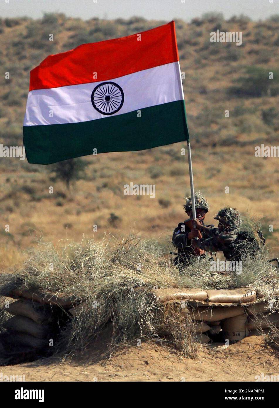 Indian army soldiers display the Indian flag during exercise "Sudarshan ...
