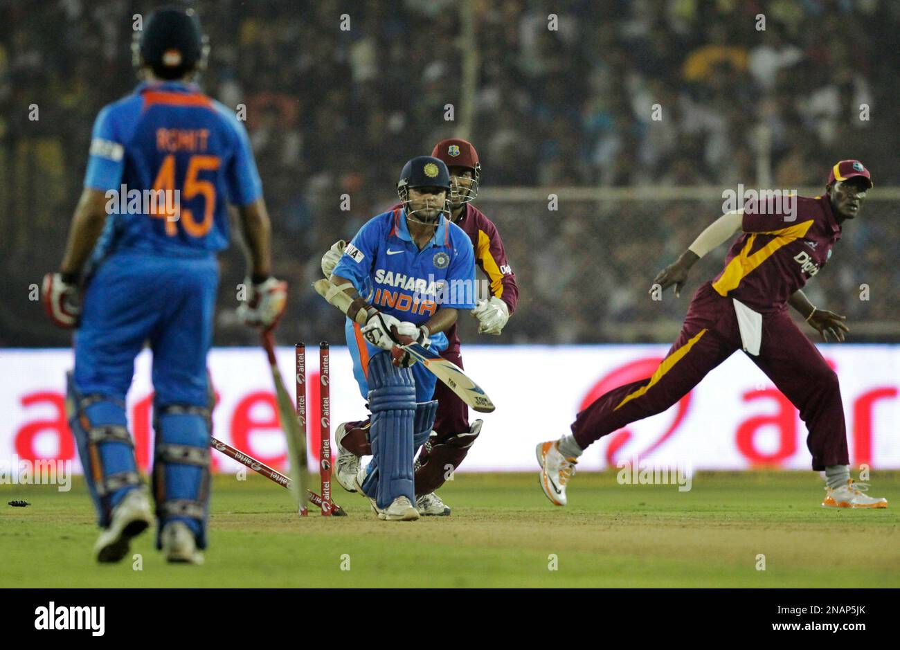 West Indies captain Darren Sammy, right and wicketkeeper Denesh Ramdin ...