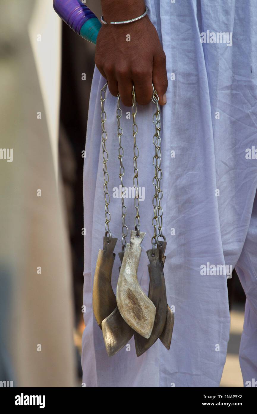 Pakistani Shiite Muslim holds knifes attached to chains prior to ...