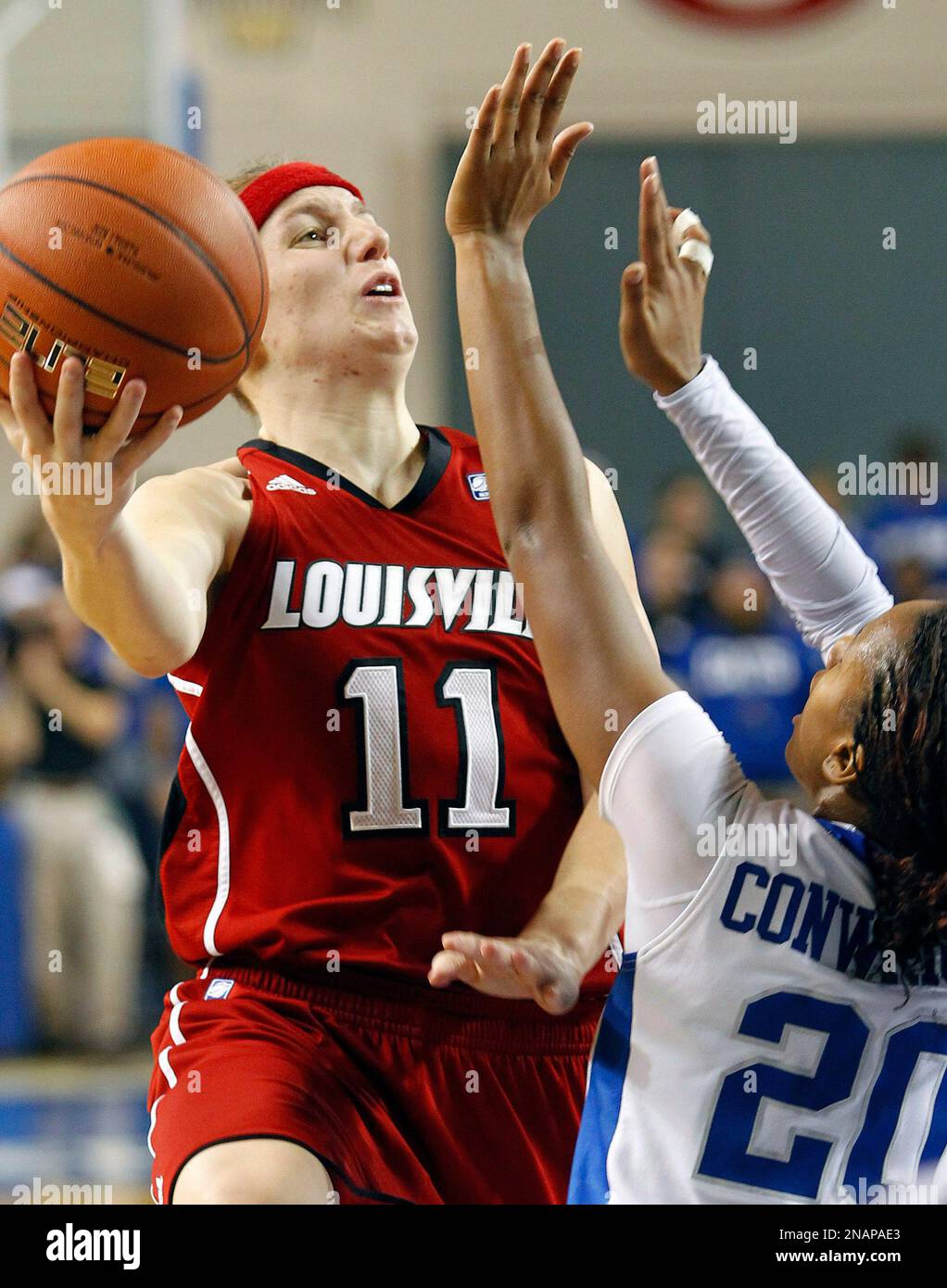 Louisville's Becky Burke, left, shoots next to Kentucky's Maegan ...