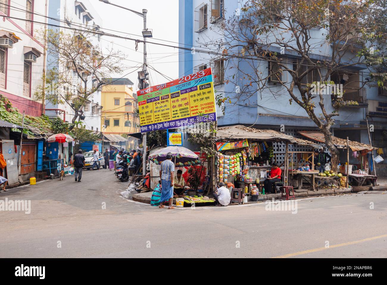 Street scene with local shops and roadside stalls in Fariapukur, Shyam ...