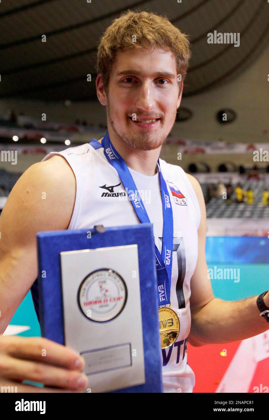 Russia's Maxim Mikhaylov wearing the gold medal leaves the award ...