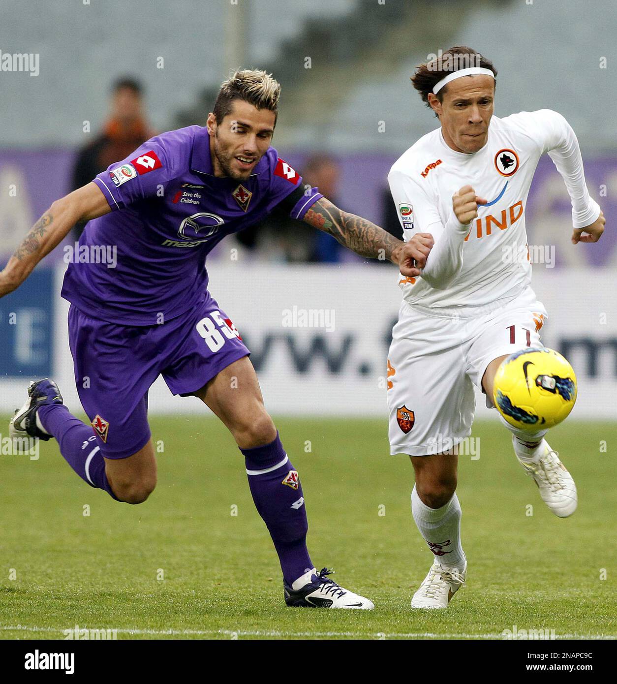 Fiorentina's Valon Behrami, left, and AS Roma's Rodrigo Taddei go for ...