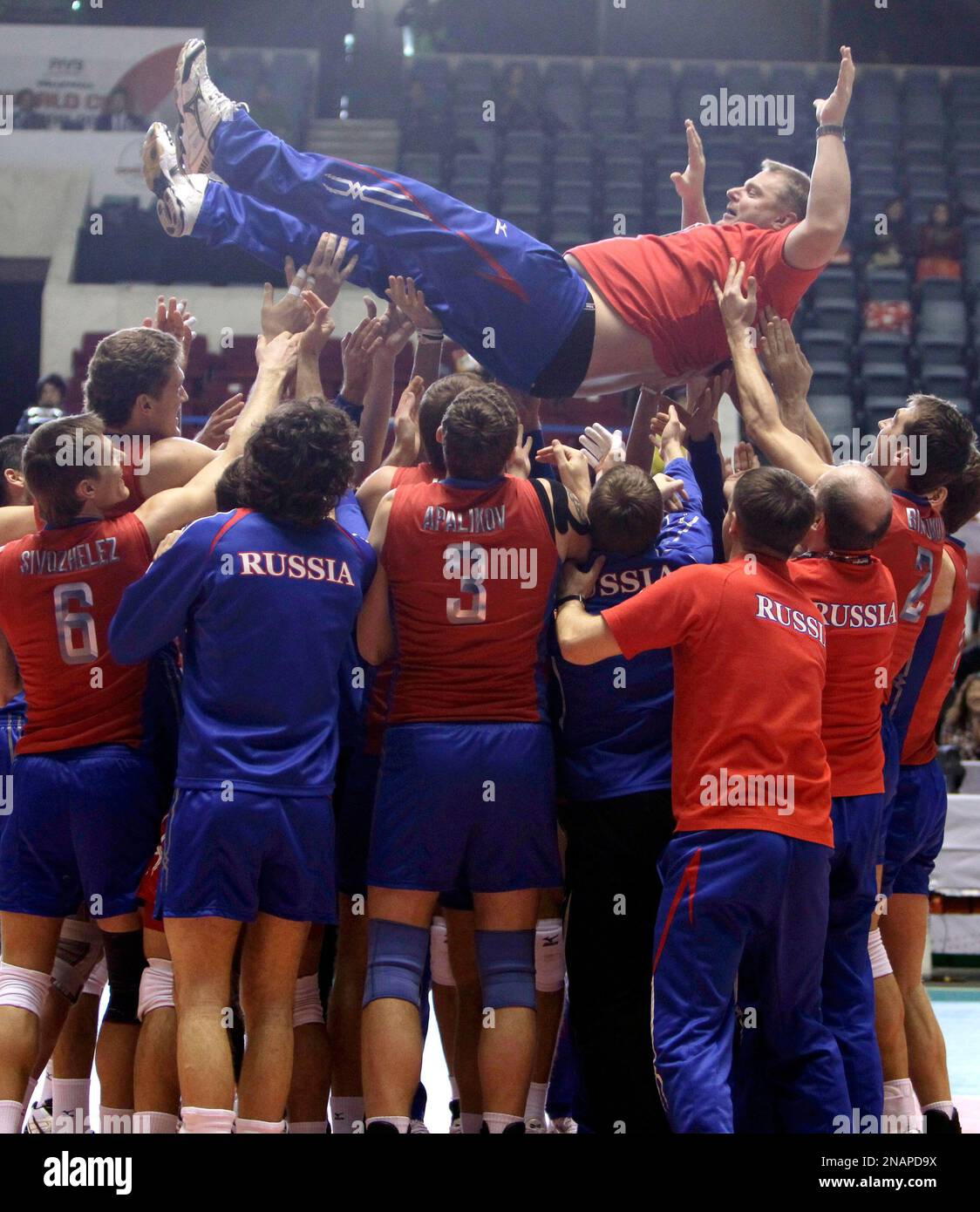 Russia players toss Head coach Vladimir Alekno in the air after beating ...
