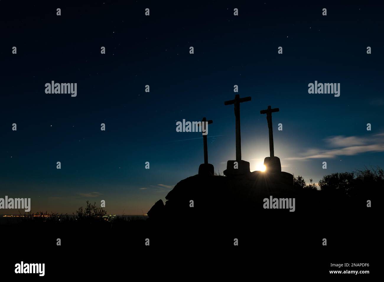 Three Crosses of carved stone on granite rock at dusk of Heaven Stock ...
