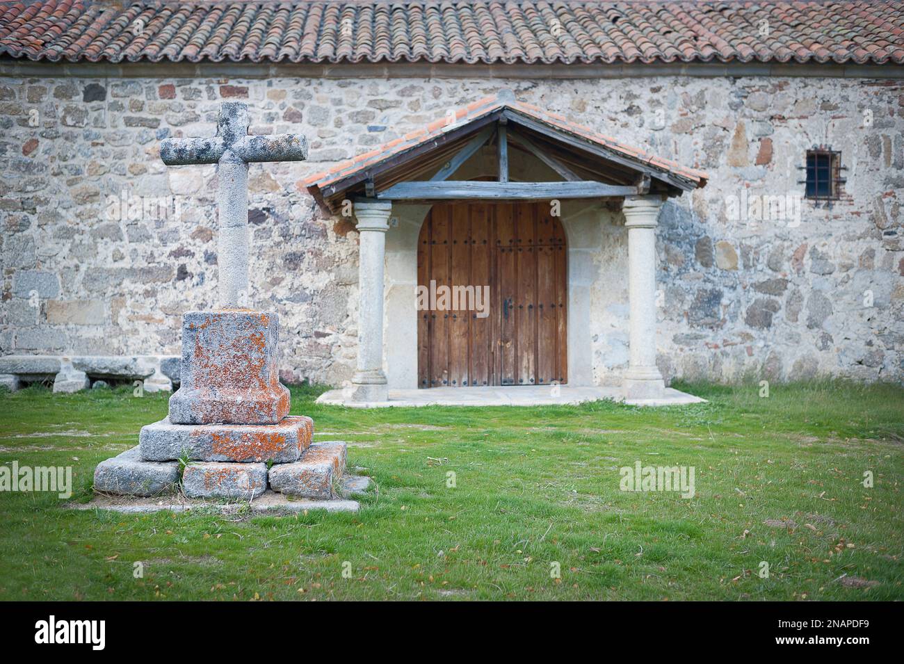religious symbol of stone on blue sky with black clouds Stock Photo - Alamy