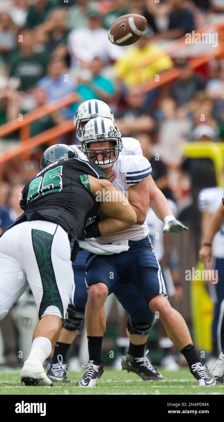 Hawaii defensive tackle Vaughn Meatoga (95) hits BYU quarterback Riley ...