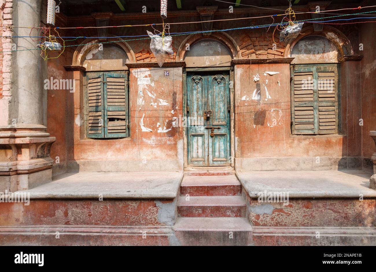 Door and wooden shutters of the front of a roadside building in ...