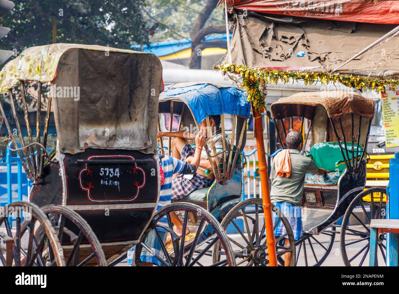 Traditional vintage wooden rickshaws parked in the street in Fariapukur ...