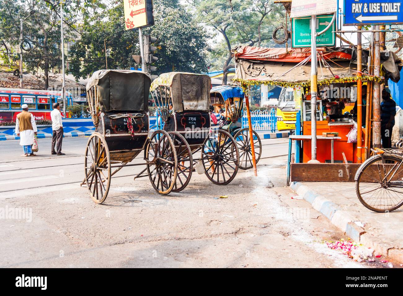 Traditional vintage wooden rickshaws parked in the street in Fariapukur ...