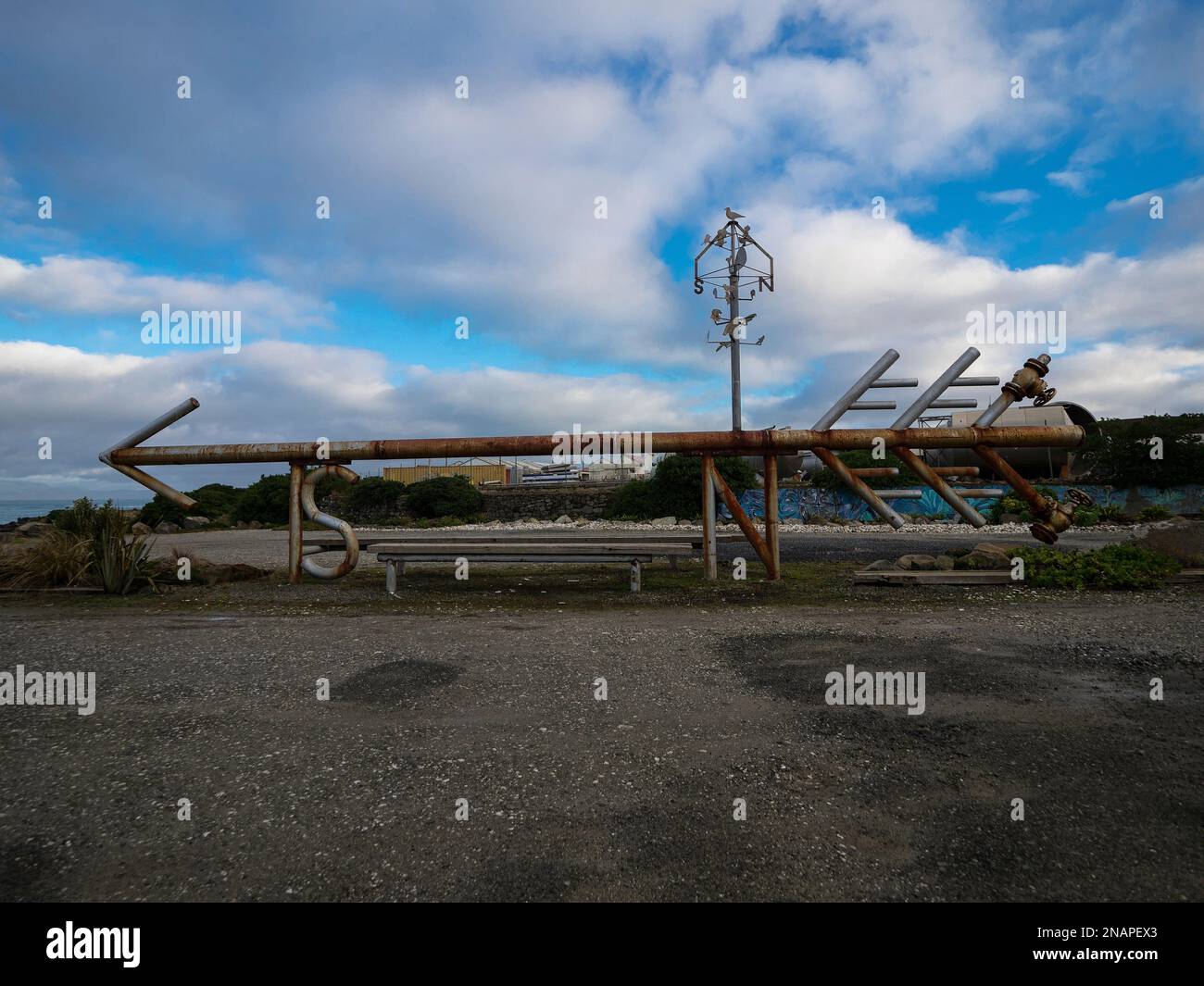 Old rusty pipe tube transformed into arrow shaped industrial design art ...