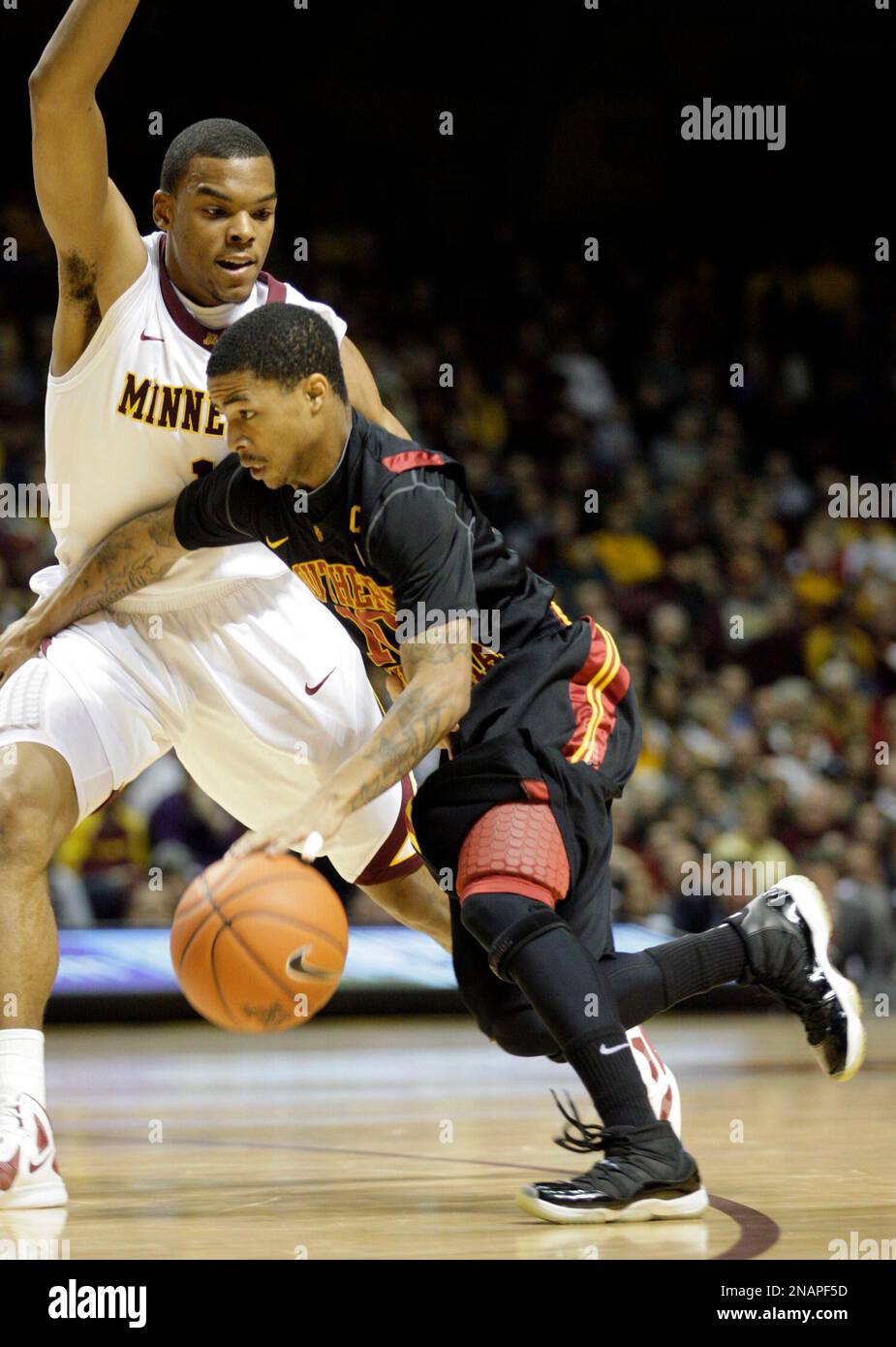 Southern California guard Maurice Jones, right, drives against ...