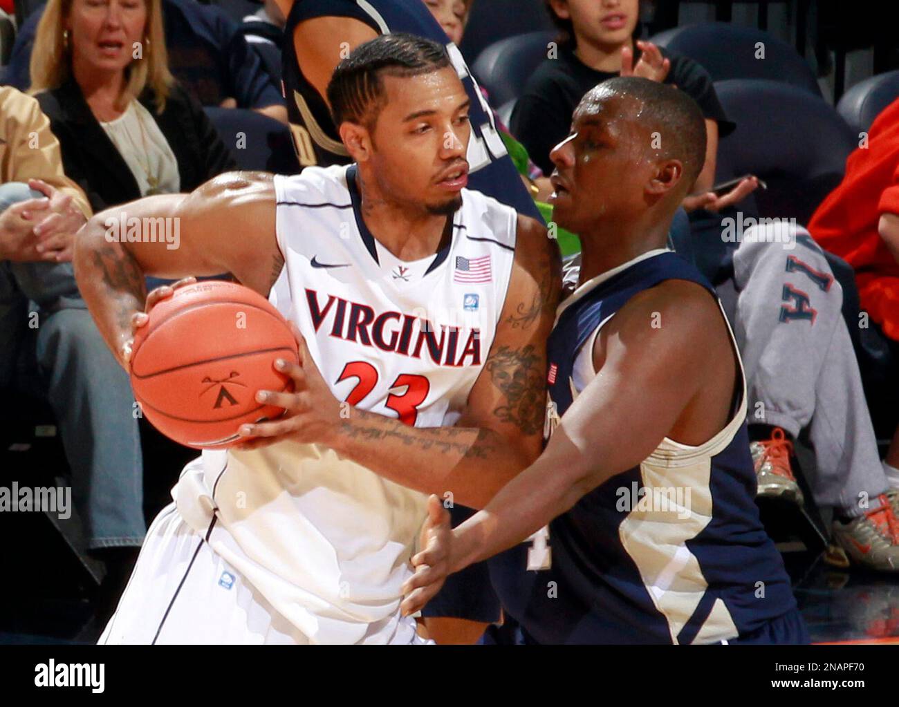 Virginia forward Mike Scott (23) is defended by Longwood center Antwan ...