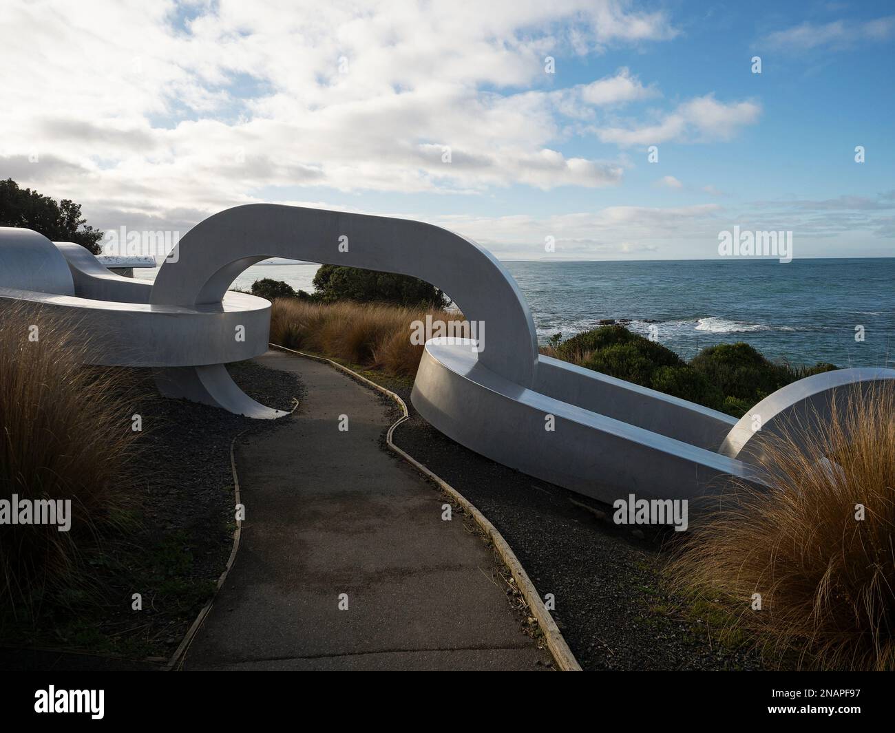 Pedestrian walkway through giant oversized silver anchor chain art ...