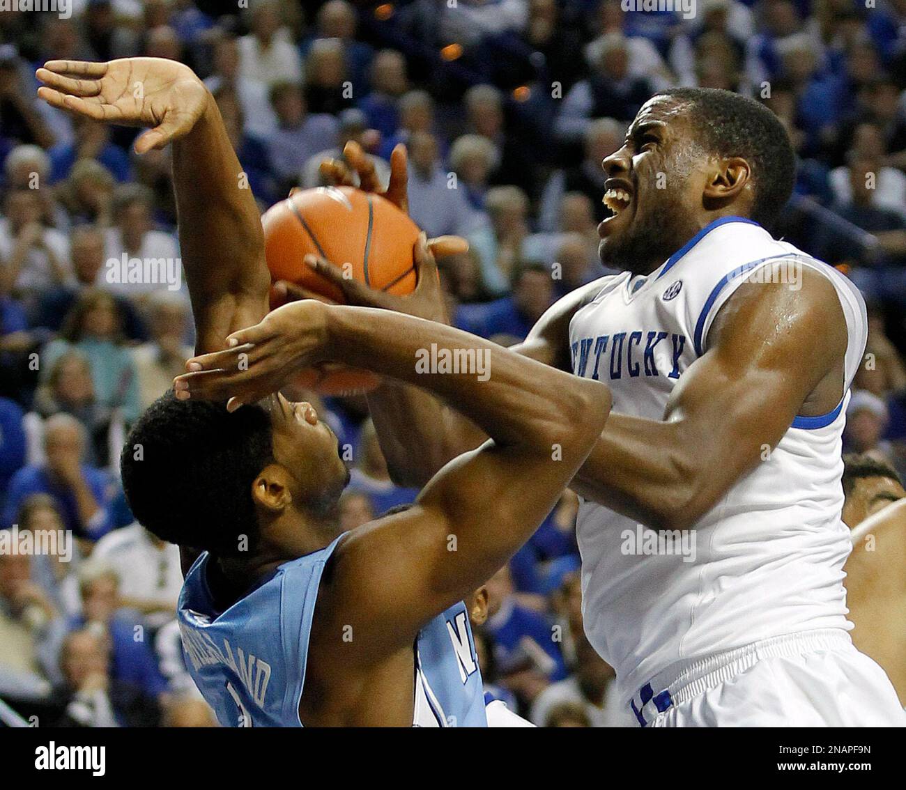 Kentucky's Darius Miller, right, shoots and is fouled by North Carolina ...