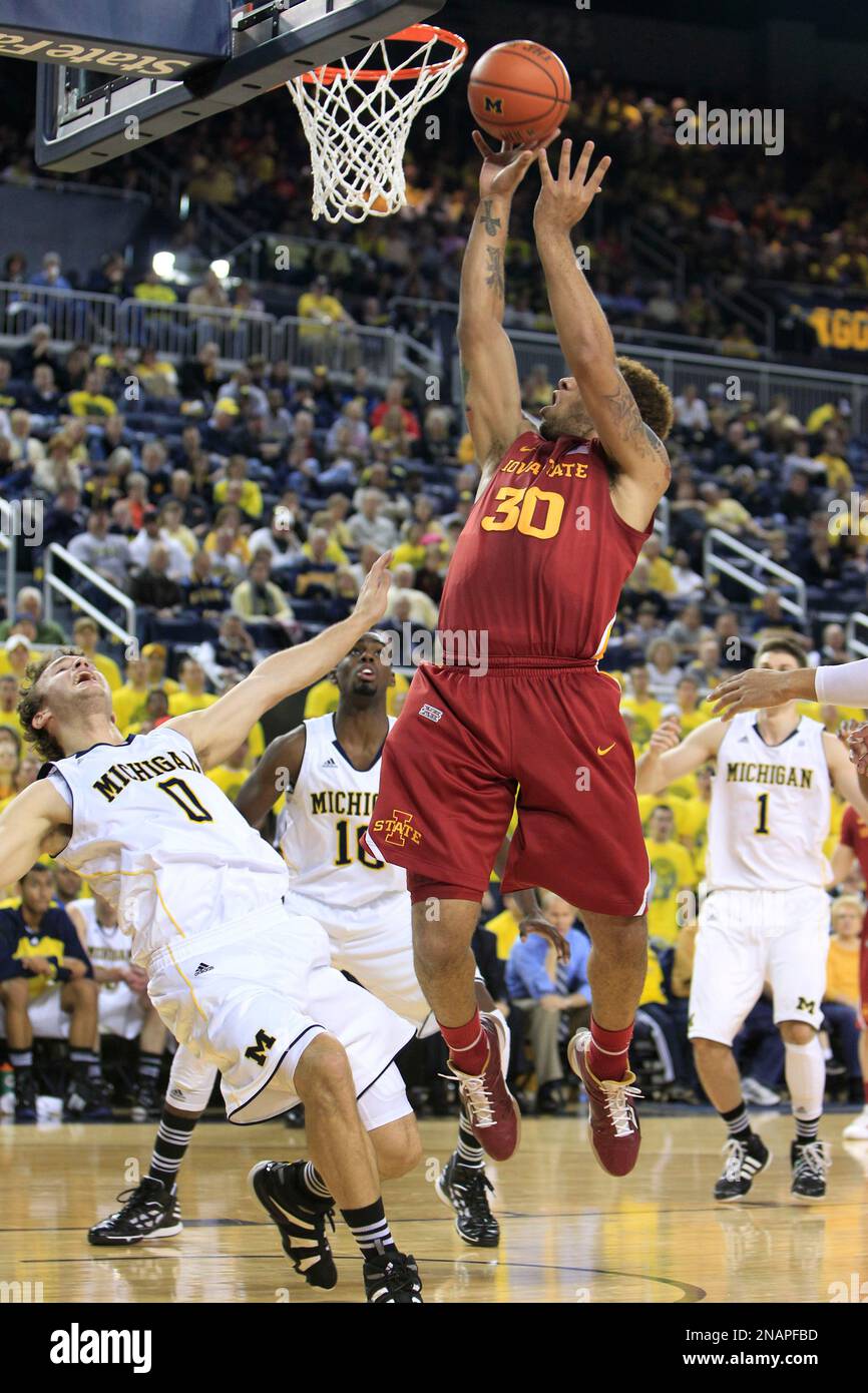 Iowa State forward Royce White (30) fouls Michigan guard Zack Novak (0 ...