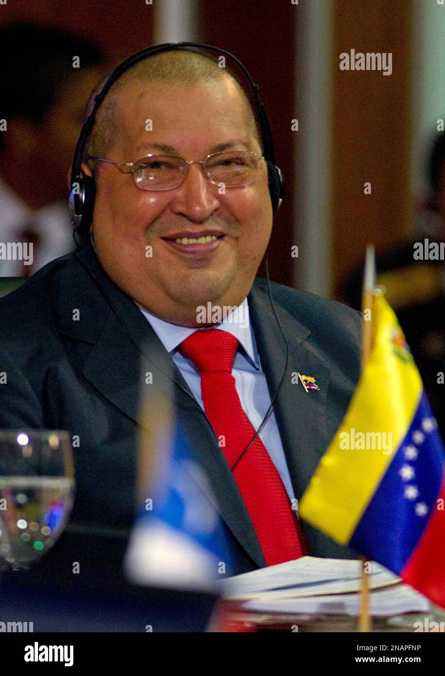 Venezuela's President Hugo Chavez smiles during a working session of ...
