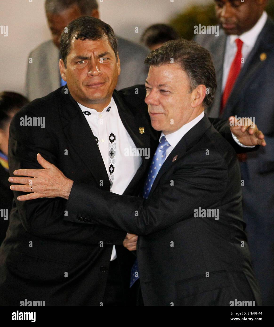 Presidents of Colombia Juan Manuel Santos, right, and Ecuador Rafael ...