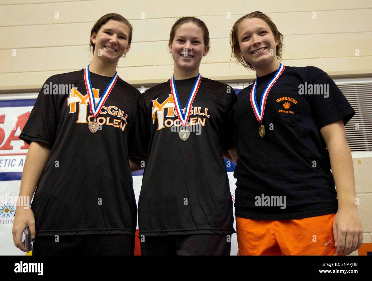 Winners of the women's diving championships pose for a photograph ...