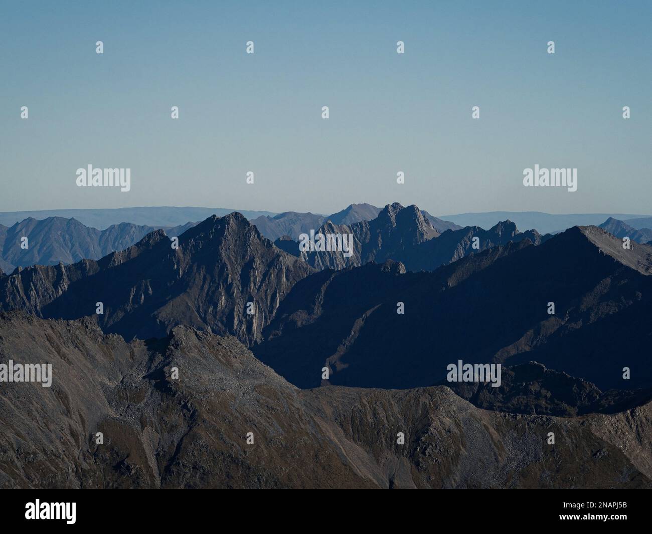 Alpine mountain silhouette layers, nature landscape panorama seen from Mount Armstrong Brewster ...