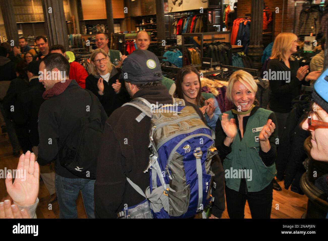 REI Employees in green welcome shoppers to the REI (Recreational ...