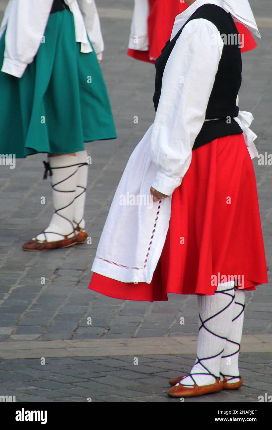 A vertical of Basque folk dancers in the street Stock Photo - Alamy