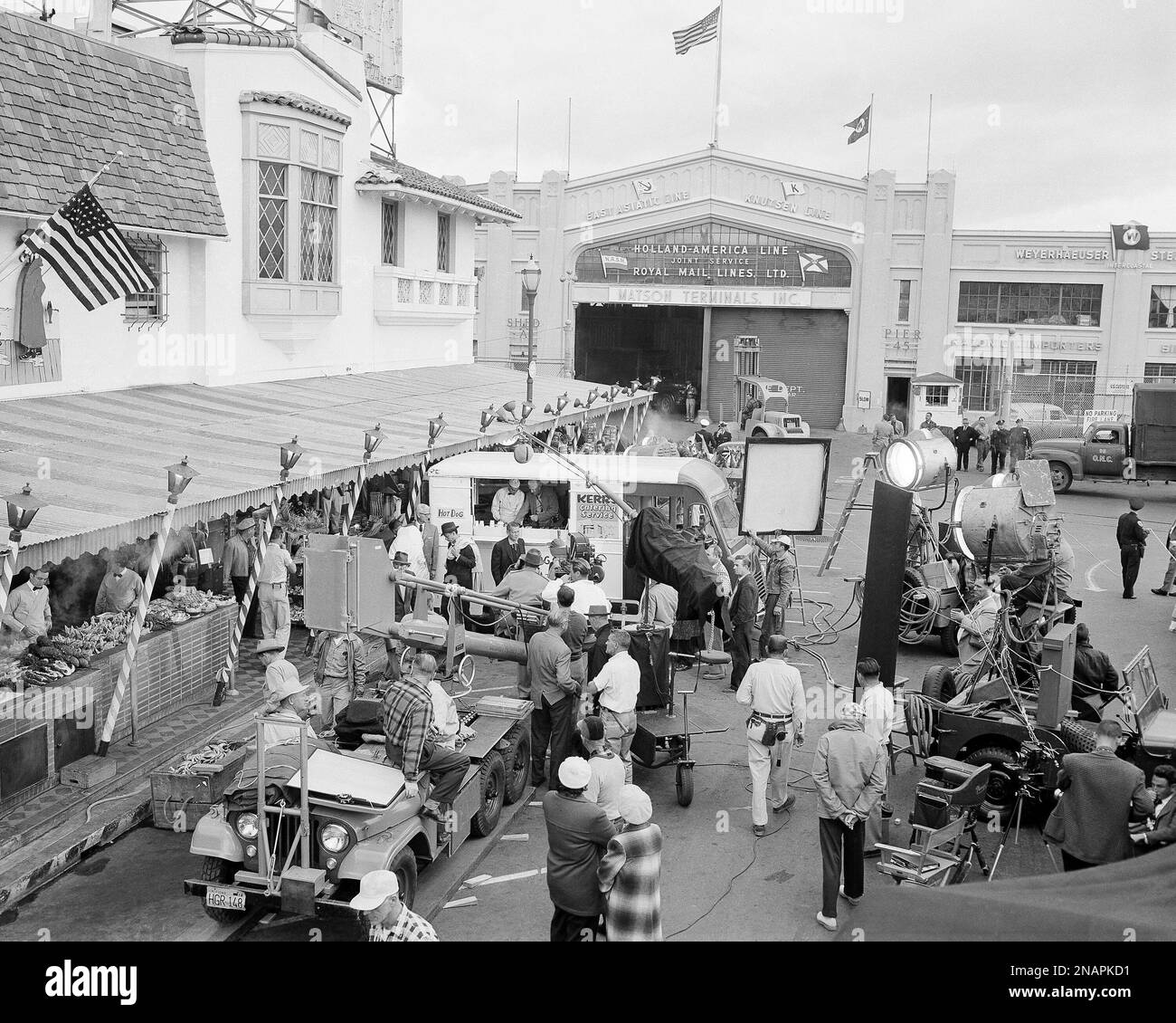 Film cameramen, electricians and technicians set up their equipment at ...