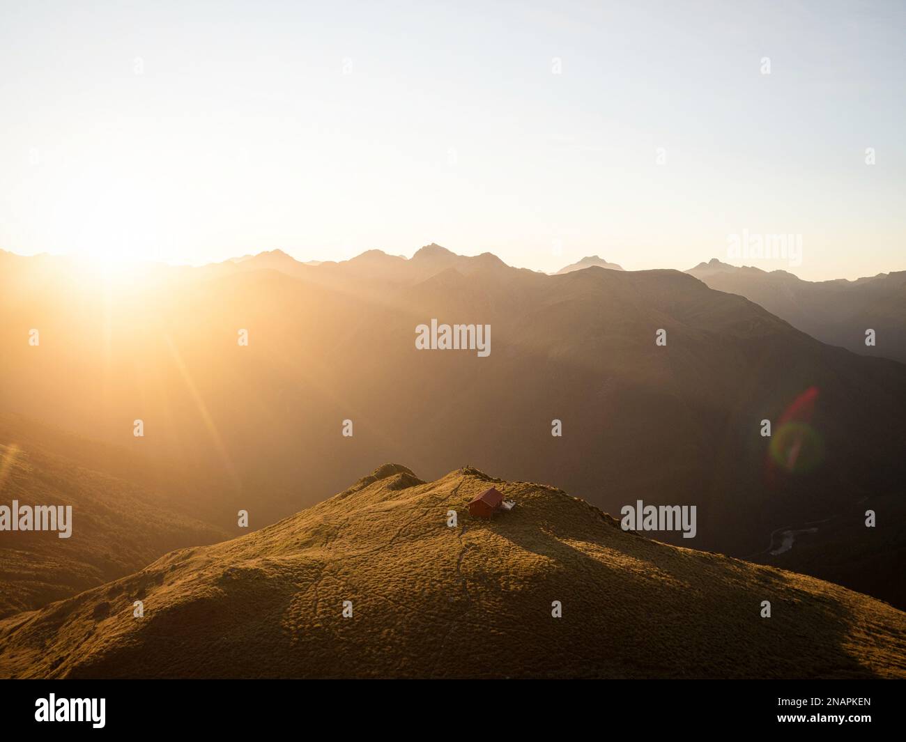 Sunset panorama of red idyllic remote lonely alpine mountain Brewster ...