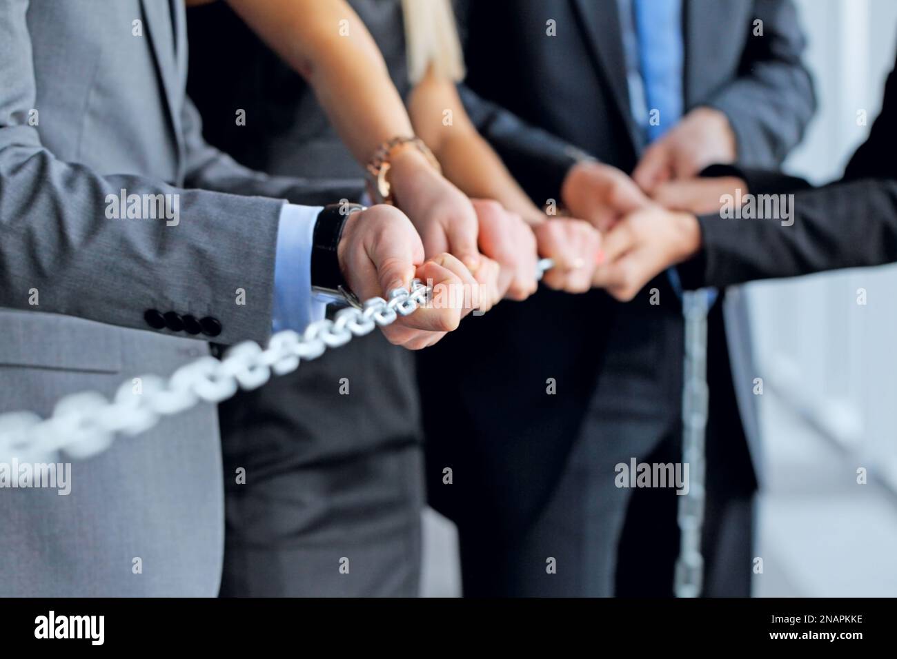 Business people pulling chain, teamwork togetherness concept Stock ...