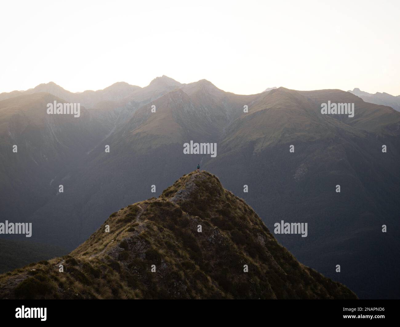 Young female woman hiking along scenic idyllic remote alpine mountain ...