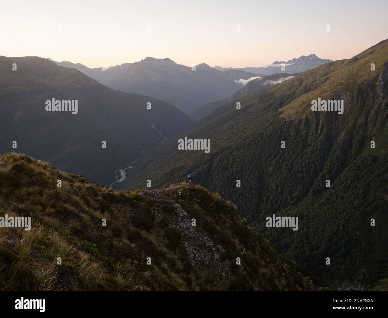 Young female woman hiking along scenic idyllic remote alpine mountain ...