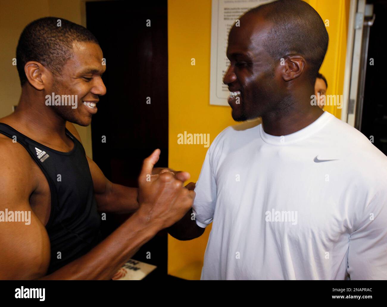 Miami Heat forward James Jones, left, and center Joel Anthony greet ...