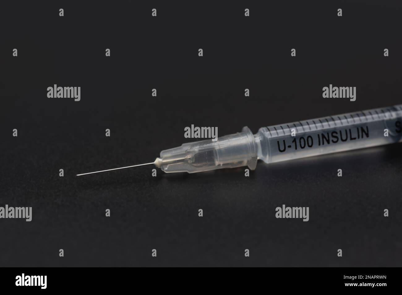 Closeup U-100 Insulin syringe on black background. Use as Medicine ...
