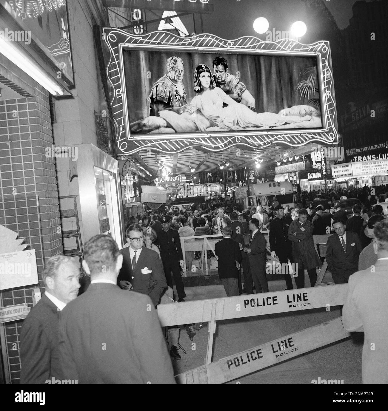Picture on the marquee illustrates the opening of the film spectacular ...