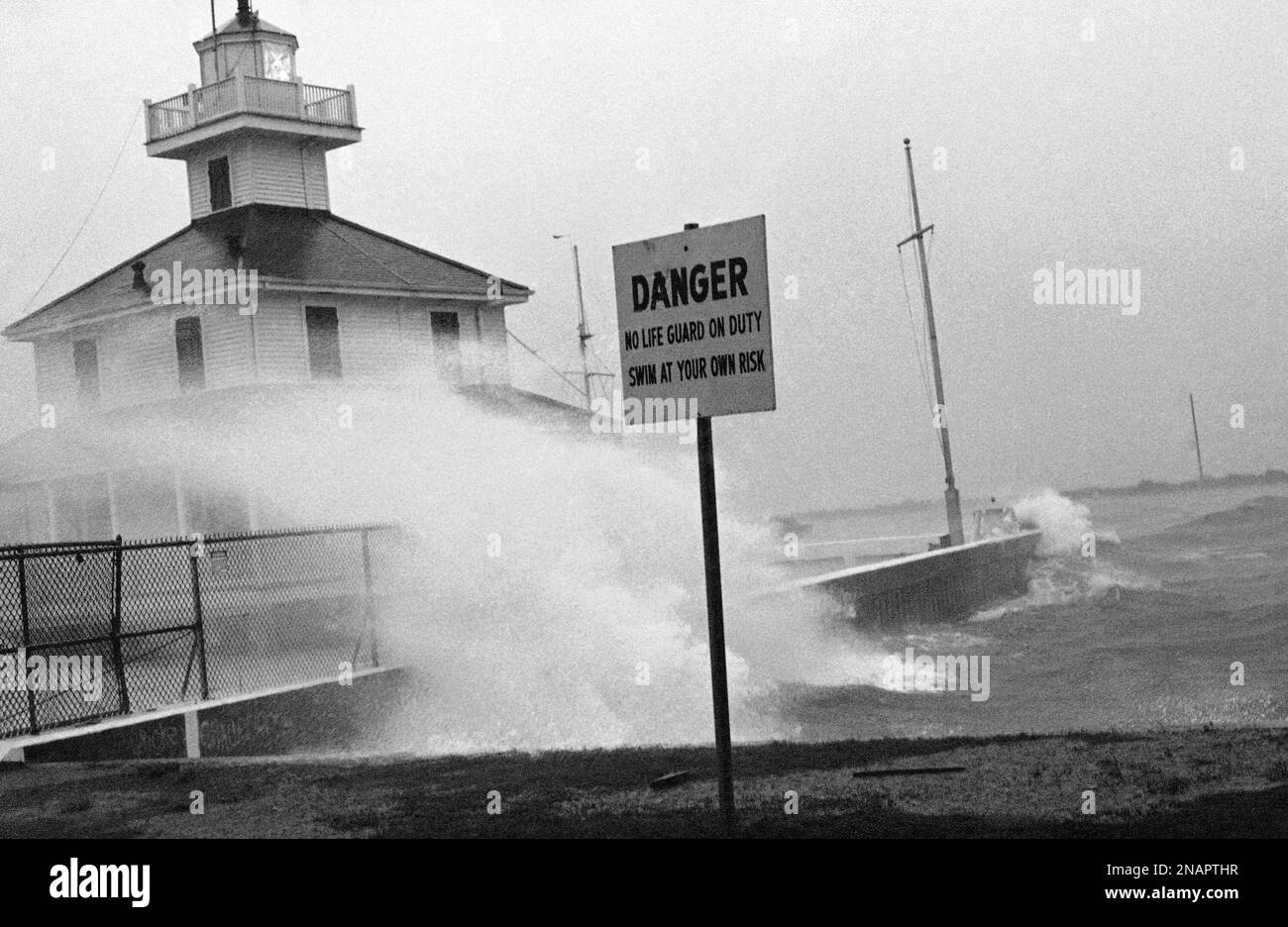 A giant wave cracks over the seawall kicked by winds from approaching ...