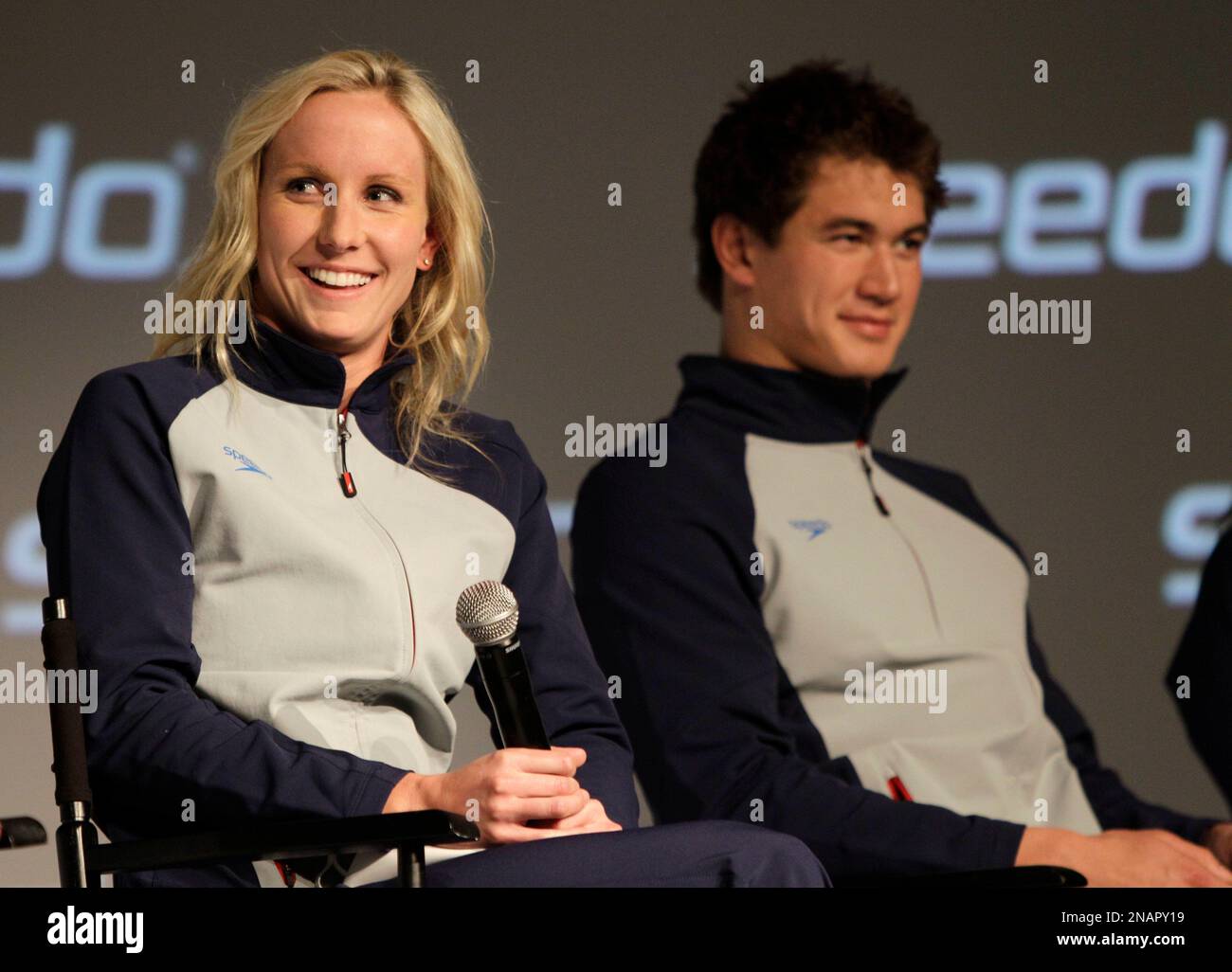United States swimmers Jessica Hardy, left, and Nathan Adrian look on ...