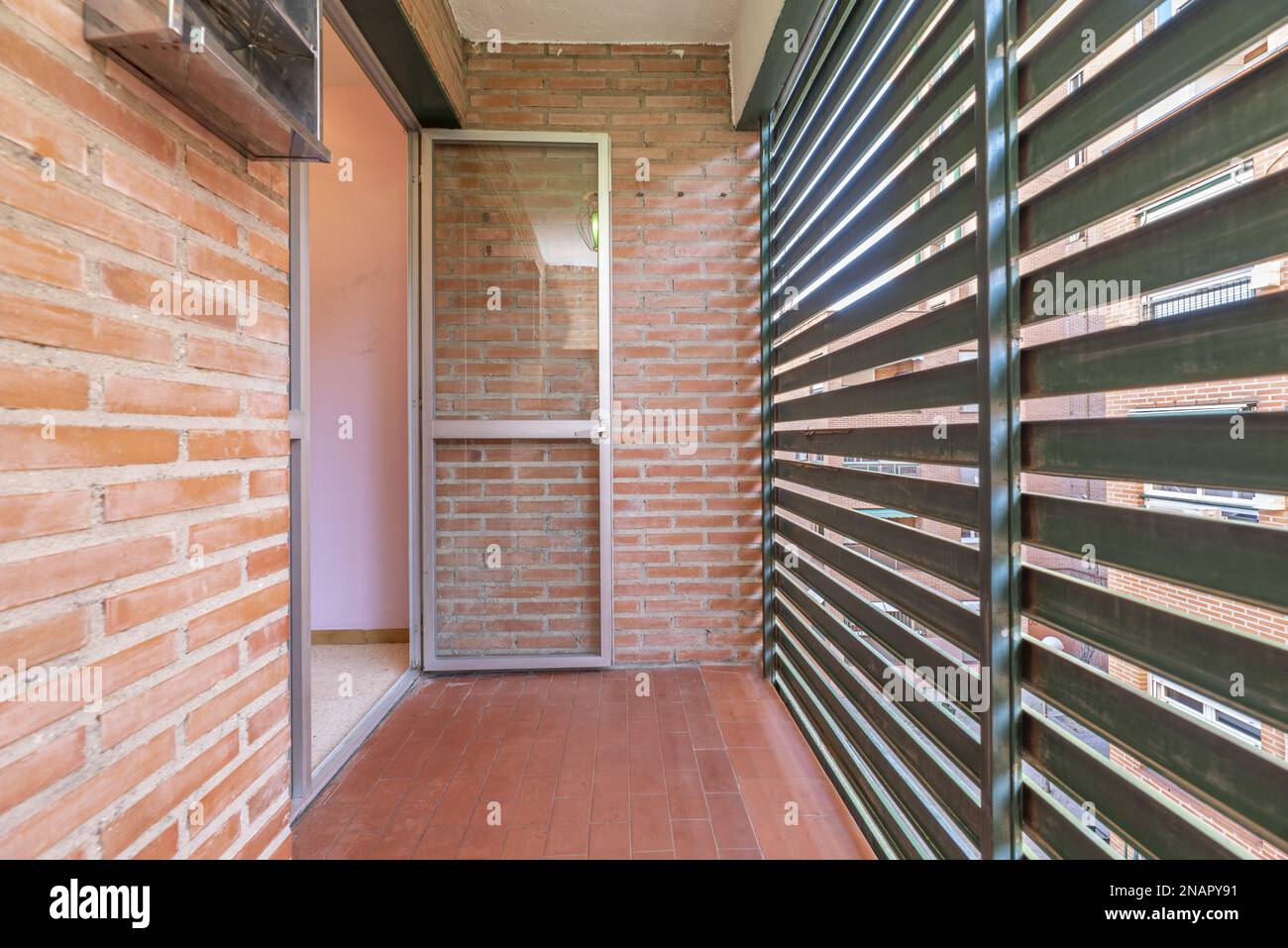 Drying rack terrace with mesh metal wall of a house with clay floors ...