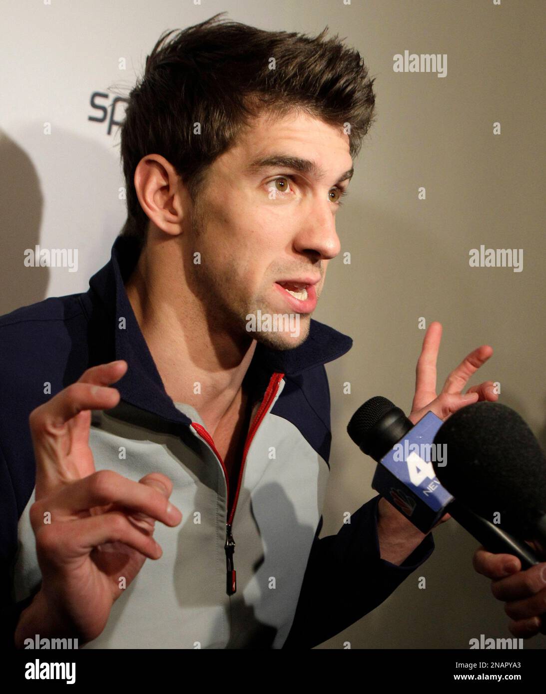 Olympic medalist Michael Phelps gestures as she speaks during a news ...