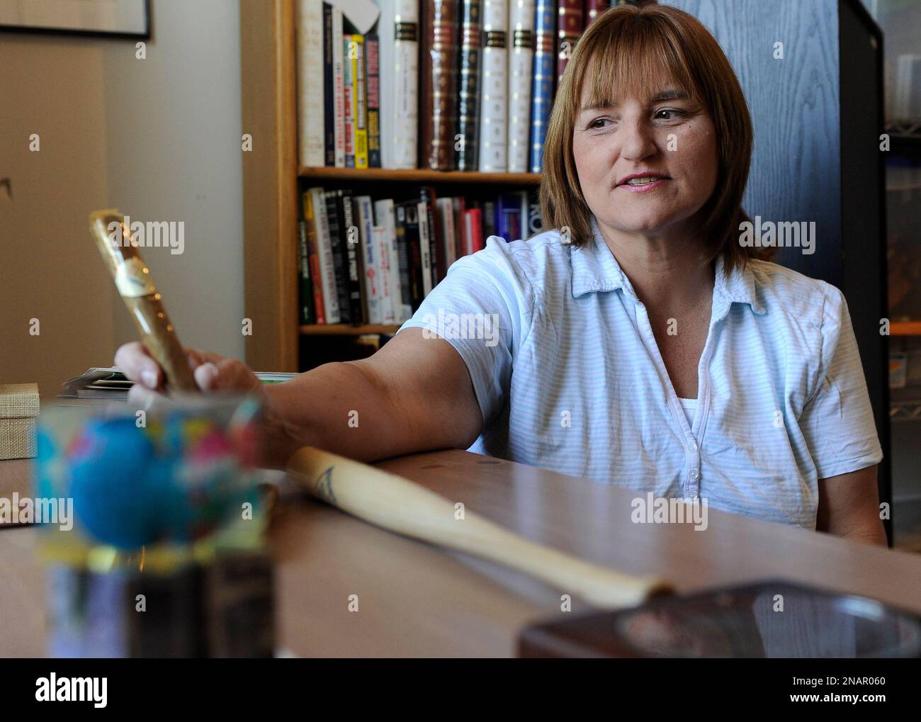 Lisa Feener, former Enron marketing services manager, holds a cigar ...