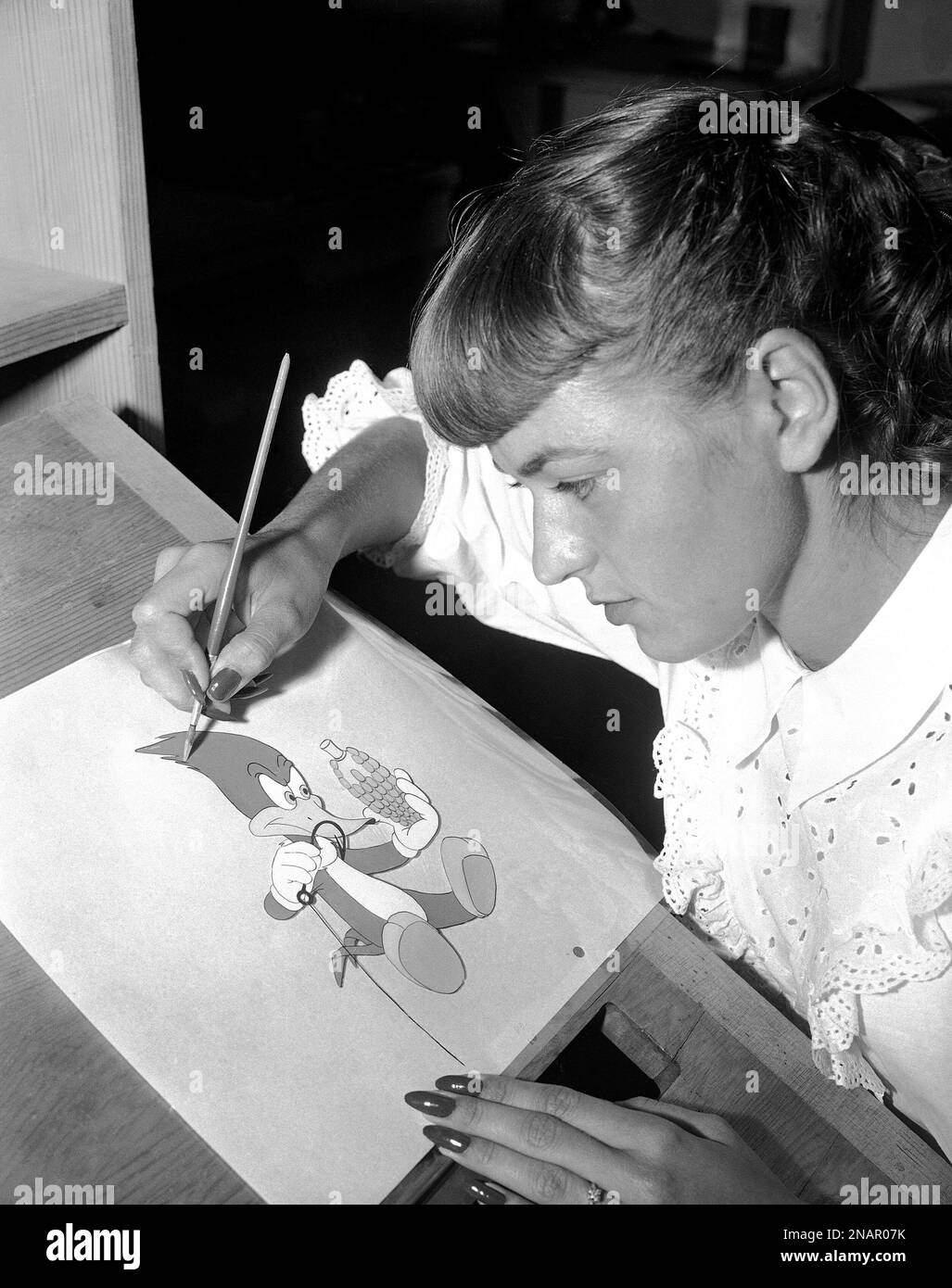 Georgette Jean works on a drawing of Woody Woodpecker, beloved ...