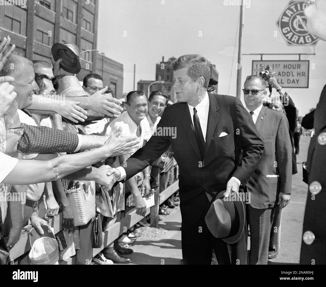 Outstretched hands reach out to shake hands with President John F ...