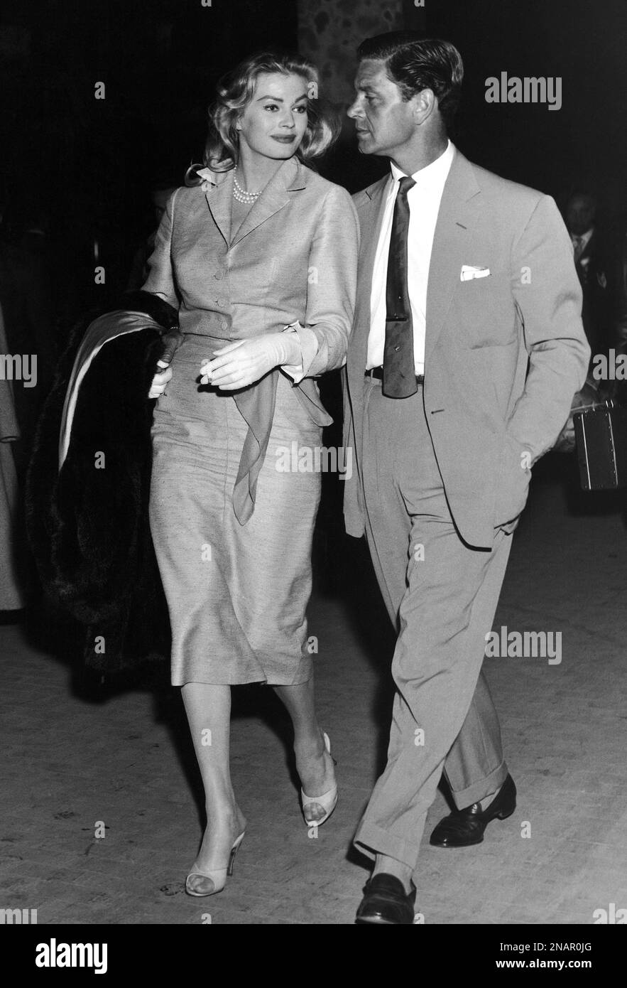 Swedish actress Anita Ekberg and English actor Anthony Steel leave the ...